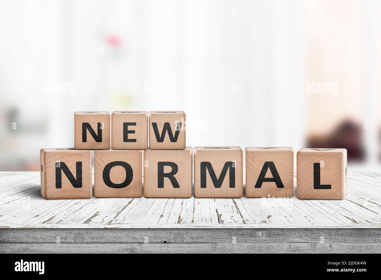 New normal lifestyle sign on a white table in a bright living area of ...