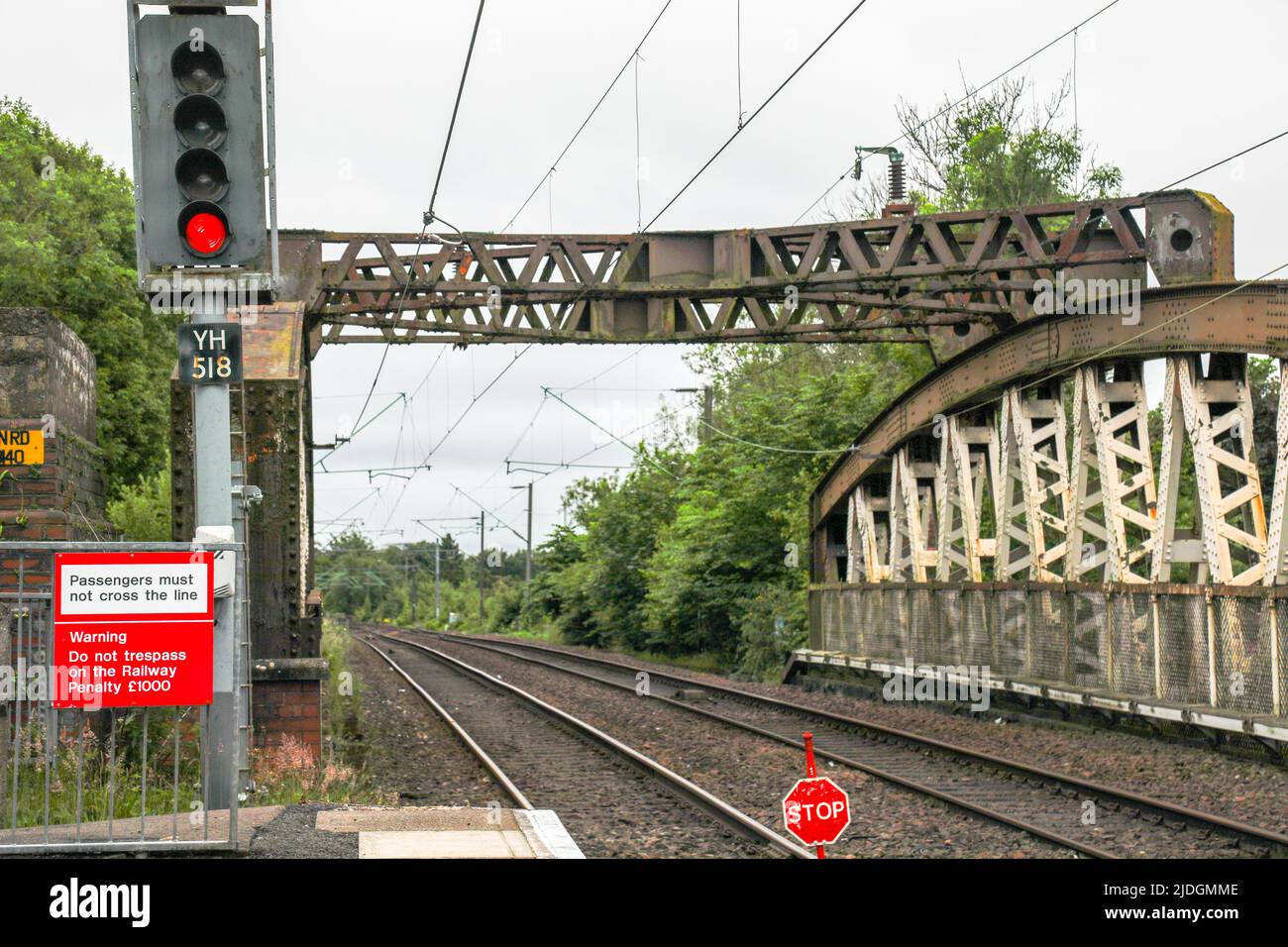 A deserted Glasgow train station platform at peak travelling time as ...