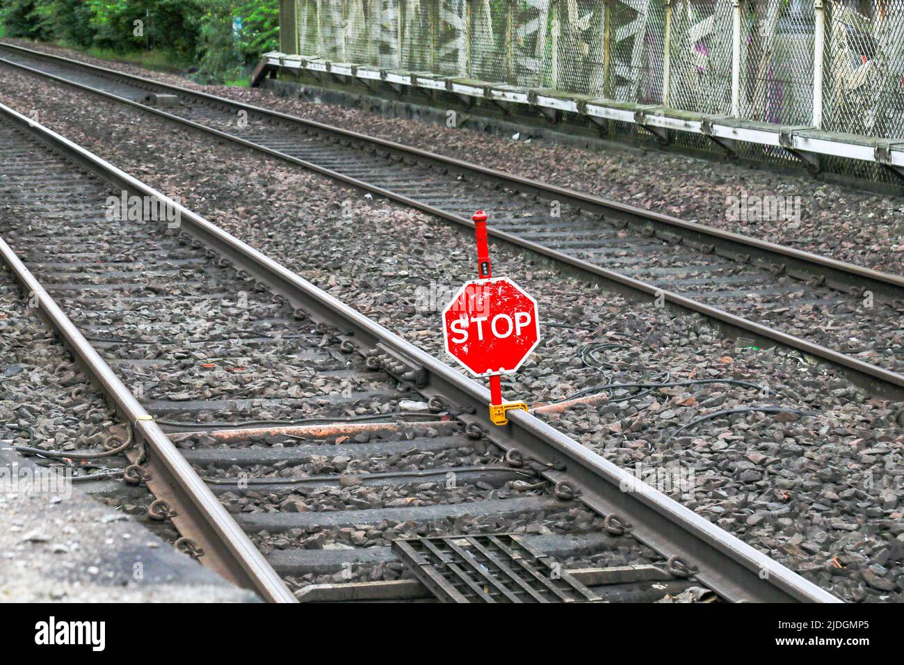 A deserted Glasgow train station platform at peak travelling time as ...
