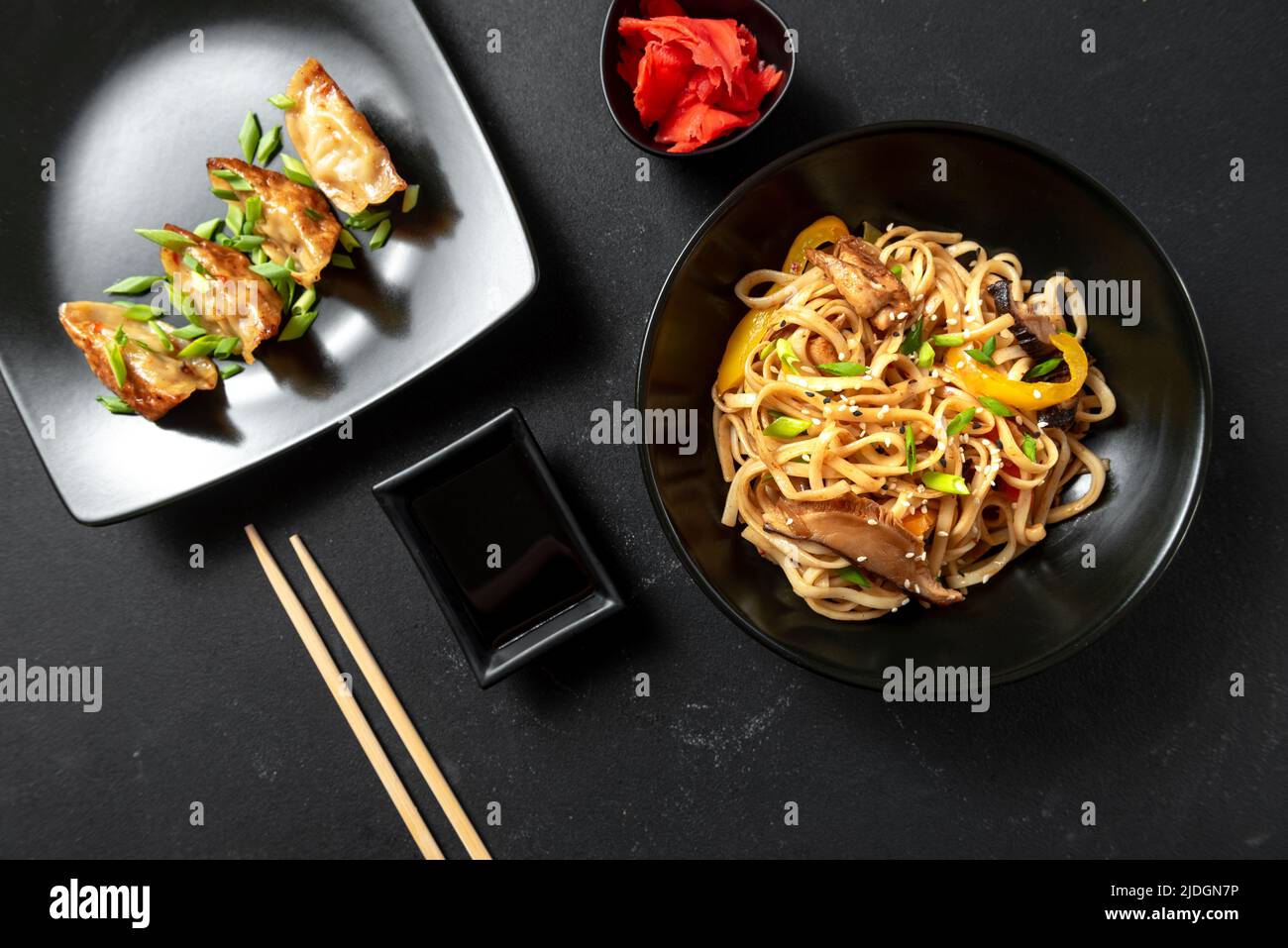 Buckwheat noodles with seafood in a bowl, top view, horizontal. Gyoza ...