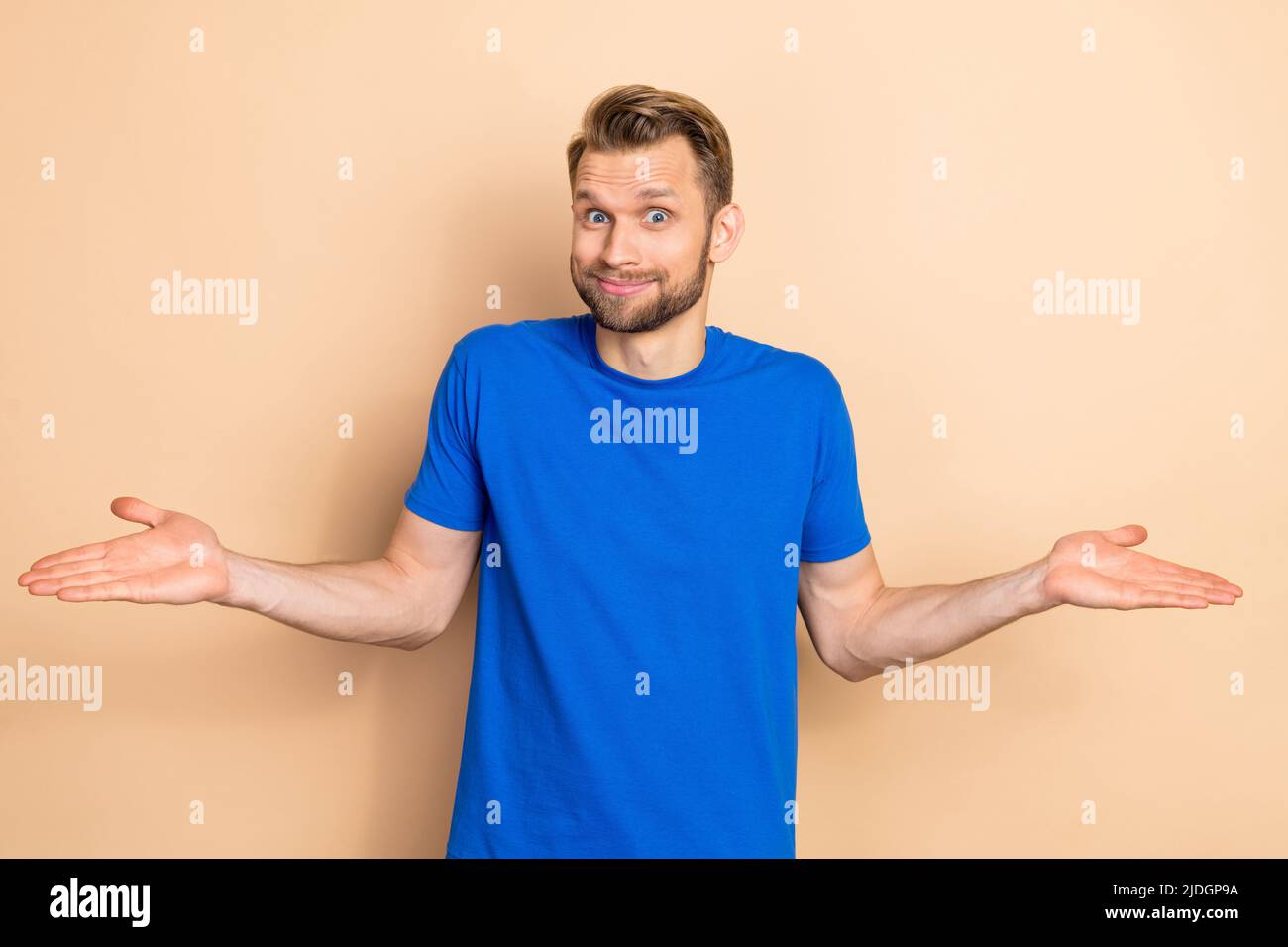 Photo of young man shrug shoulders puzzled no answer dilemma mistake ...