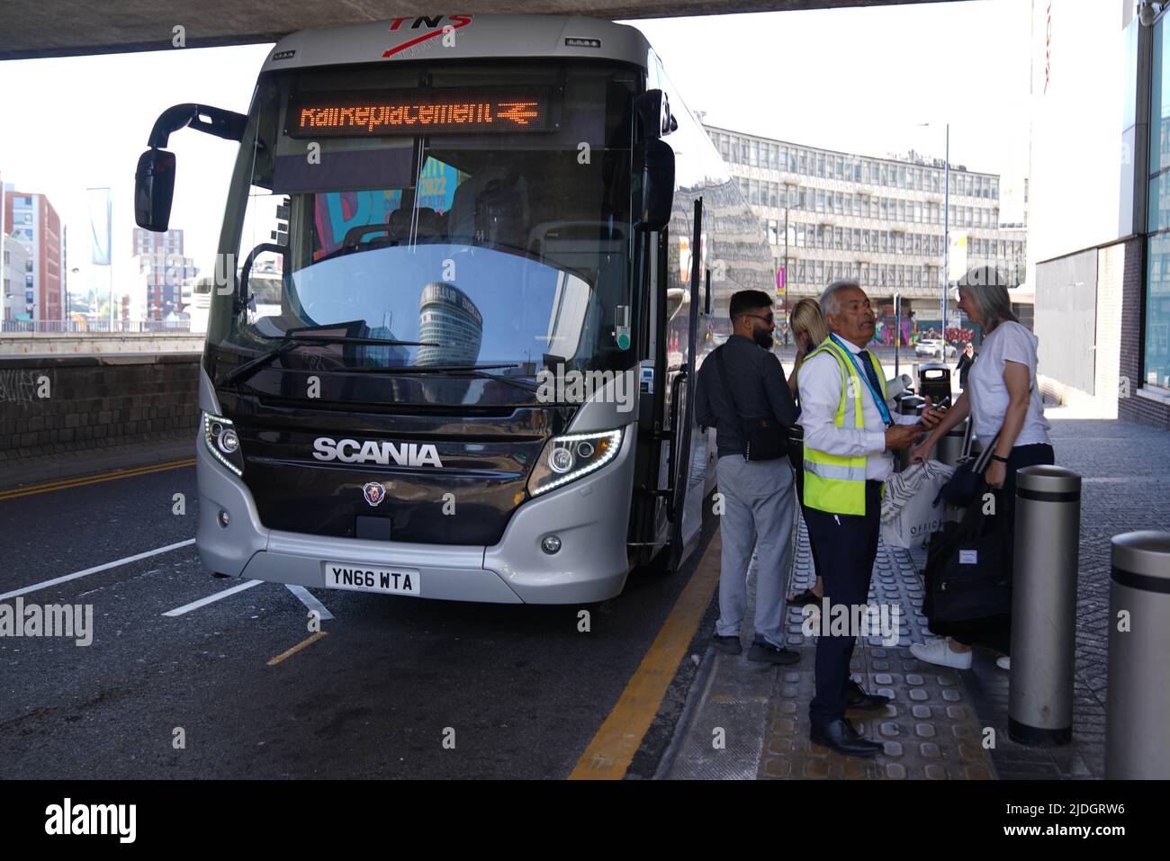 Passengers board a rail replacement bus to Bristol Temple Meads station ...