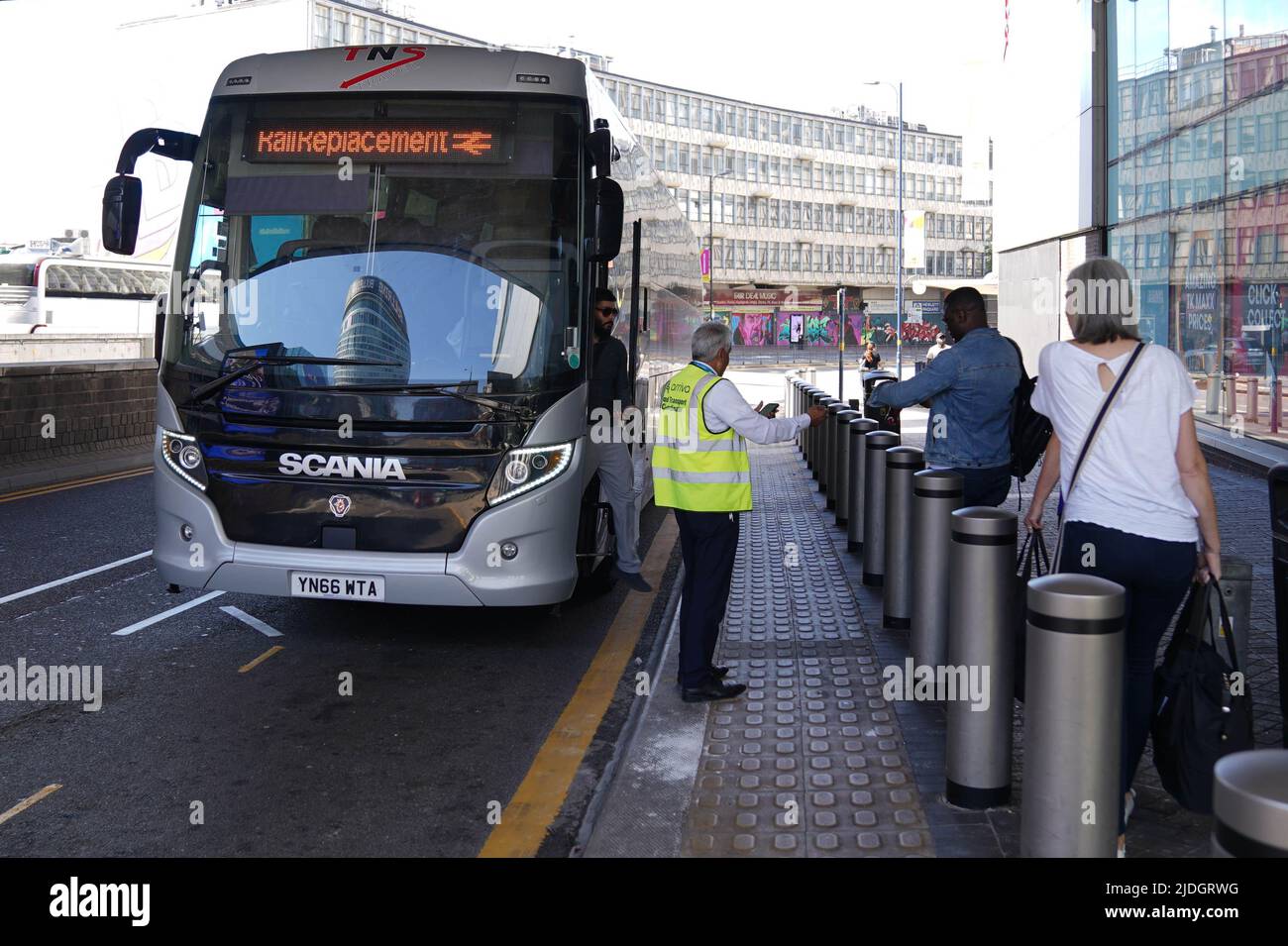 Passengers board a rail replacement bus to Bristol Temple Meads station ...