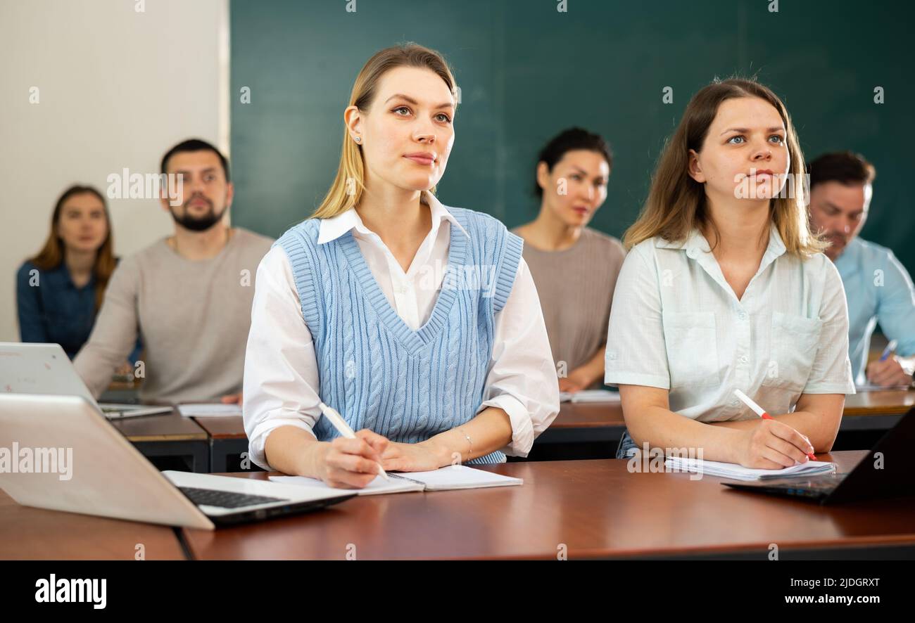 University students exercising in class room Stock Photo - Alamy