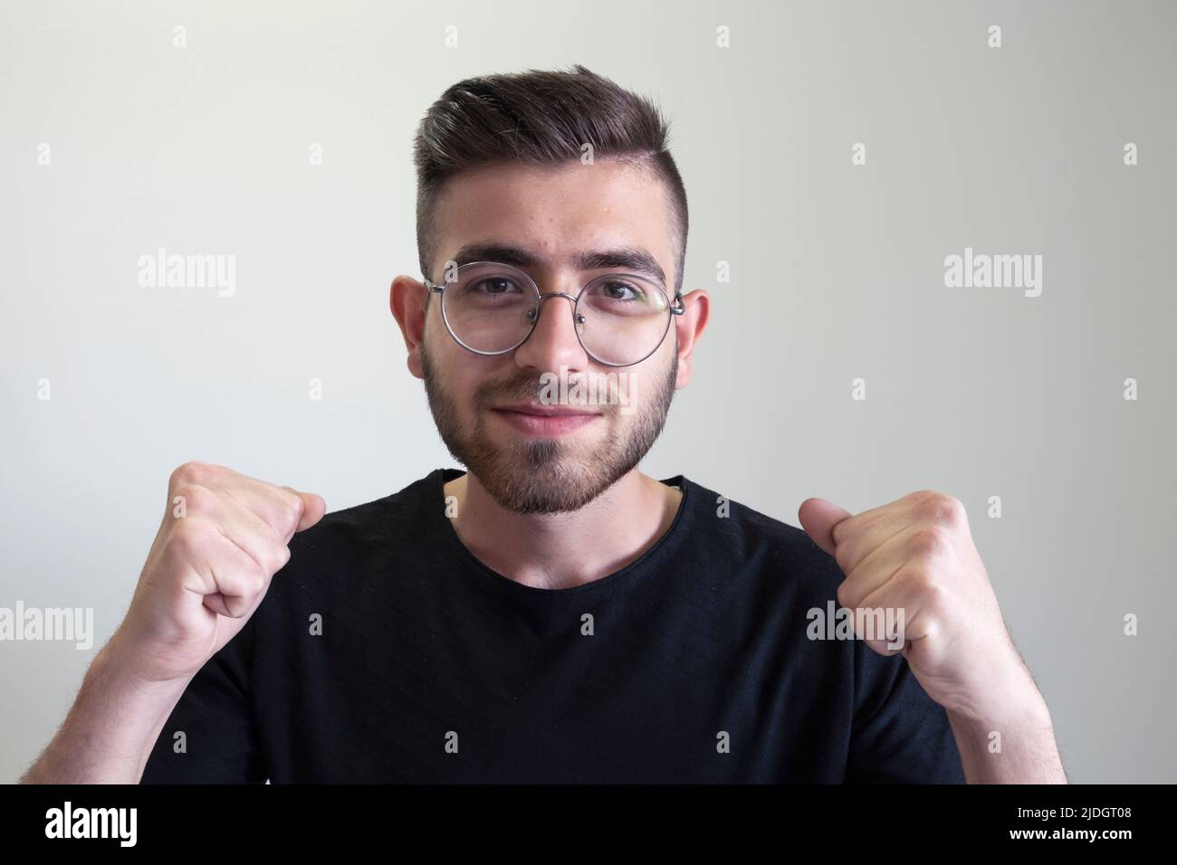 Teenager in winner position, portrait of caucasian handsome teenager in ...