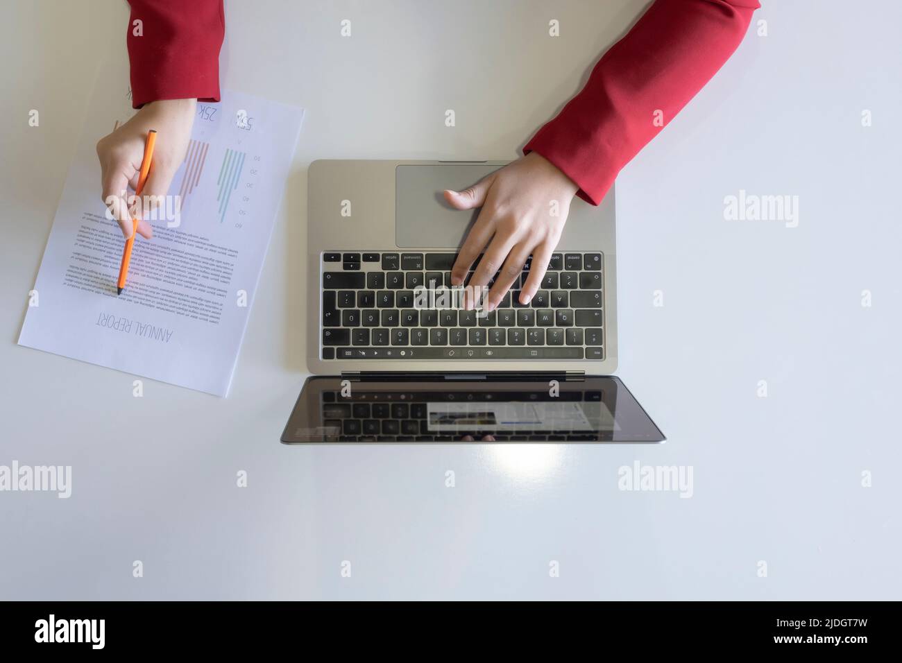 Working on laptop, top view of businesswoman working on laptop and ...
