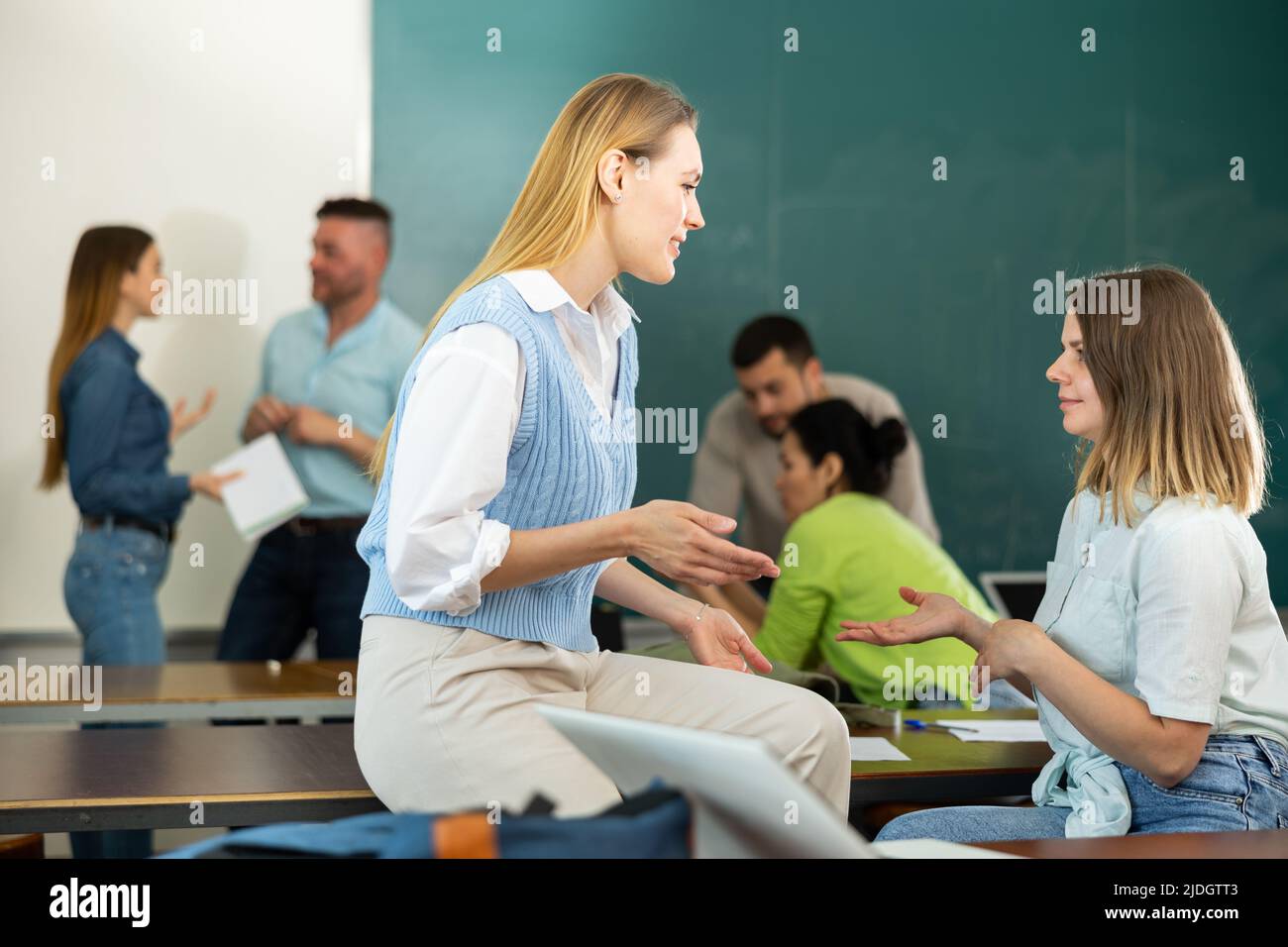 Adult students communicating during recess between lectures in ...