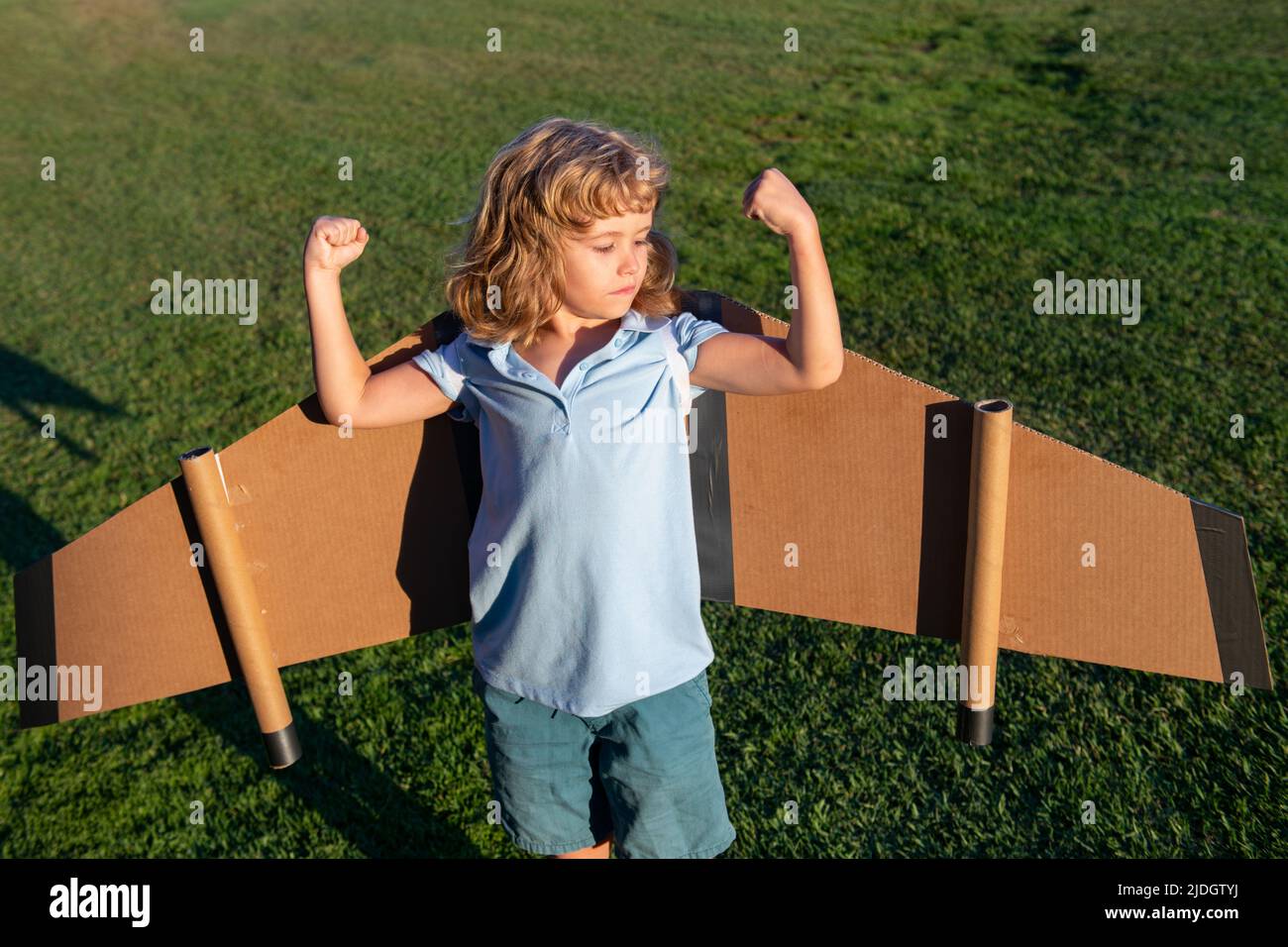 Superhero child shows muscles. Strong kid. Success, motivation concept ...