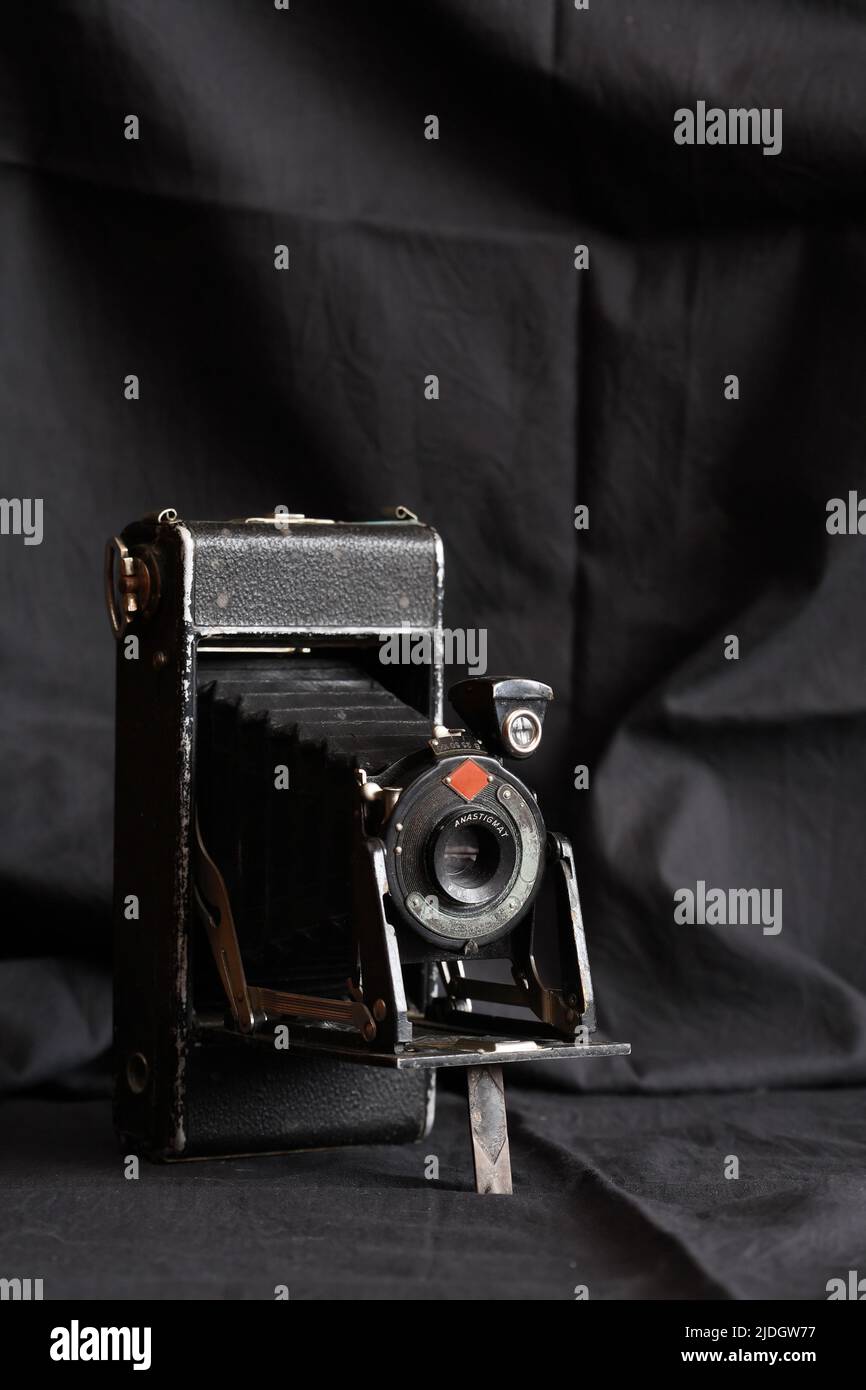Very old photo camera against nice dark cloth background Stock Photo ...