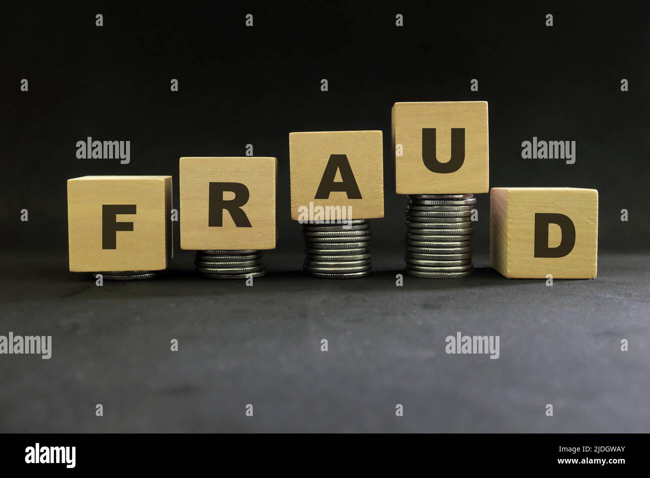 Investment scam, fraud and Ponzi scheme concept. Stack of coins on ...