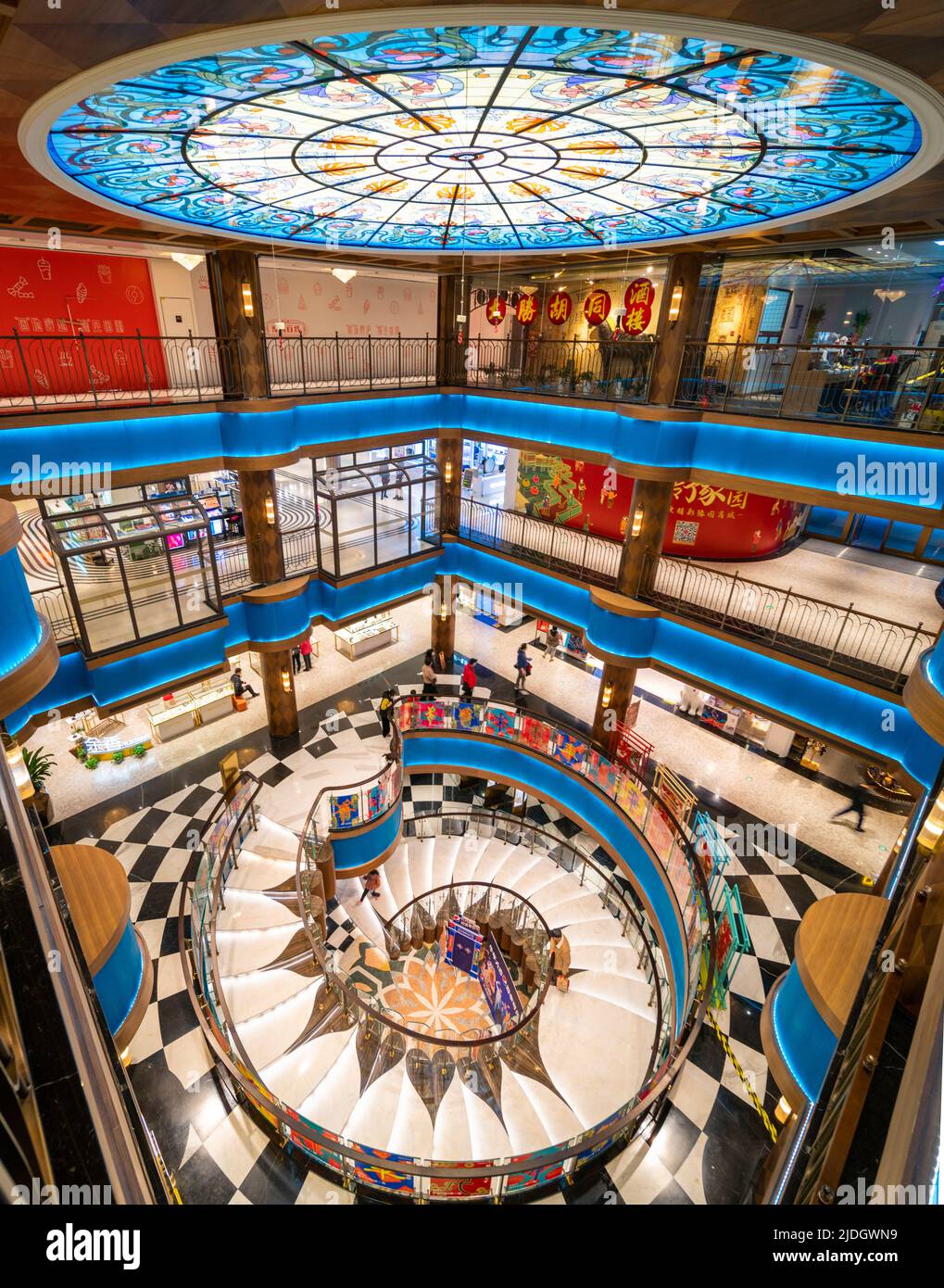 The view a nautilus staircase inside a shopping mall in Yu Yuan Stock ...