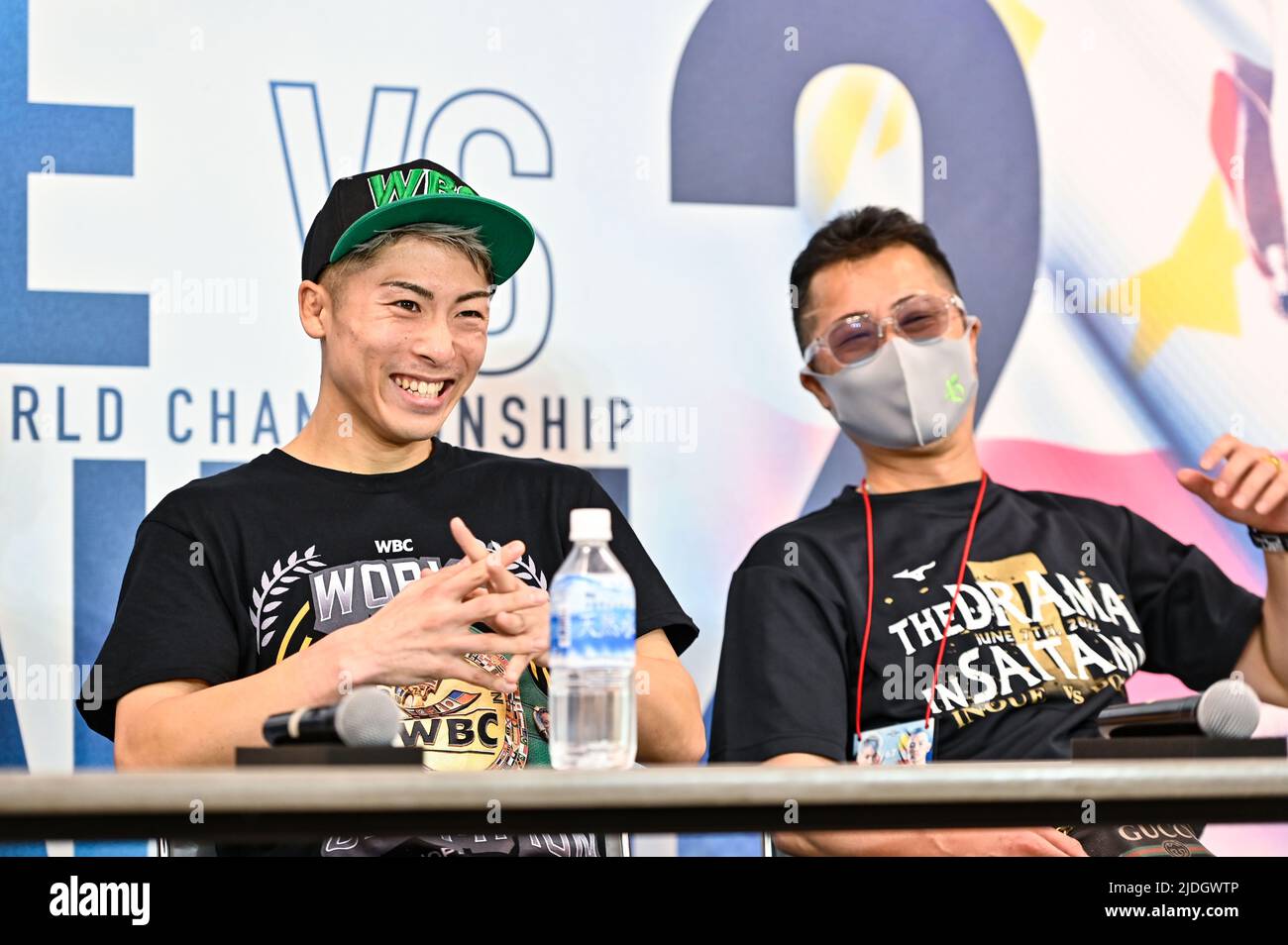 Naoya Inoue (L) of Japan attends a press conference with his trainer ...