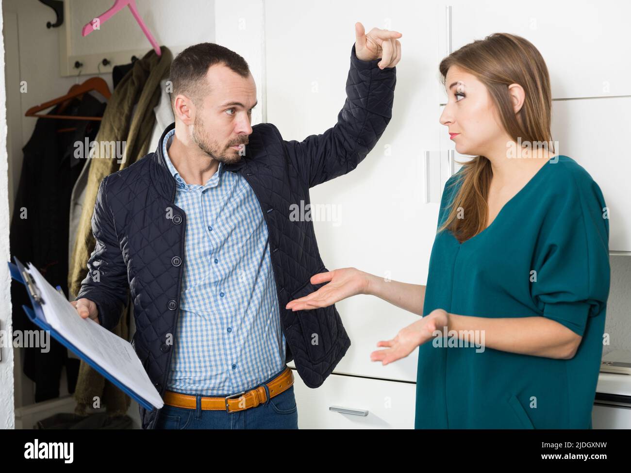 Annoyed debt collector and shocked woman Stock Photo - Alamy