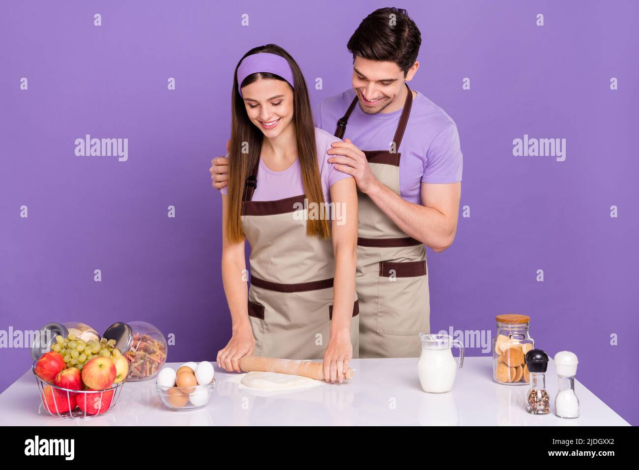 Photo of dreamy cute husband wife wear grey aprons backing biscuits ...