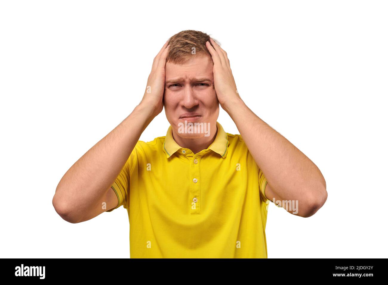 Upset man in yellow T-shirt clutched at his head, forgetful man with ...