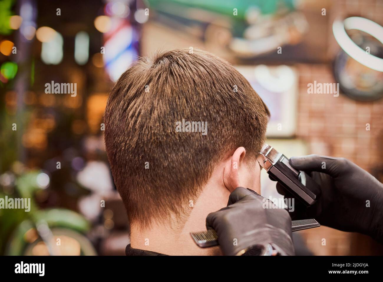 Professional hairdresser makes short hairstyle hi-res stock photography ...