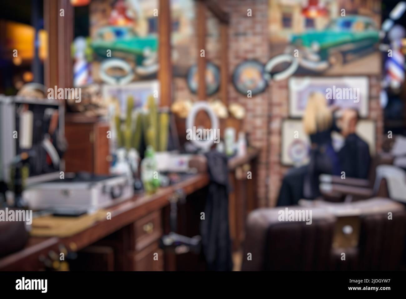 Blurred loft stylish barbershop interior with wooden countertops and ...