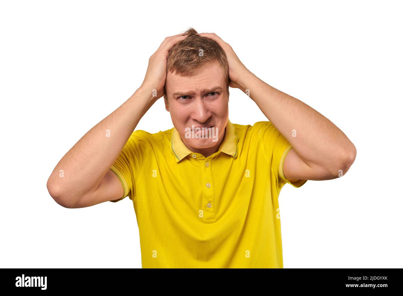 Upset man in yellow T-shirt clutched at his head, forgetful man with ...