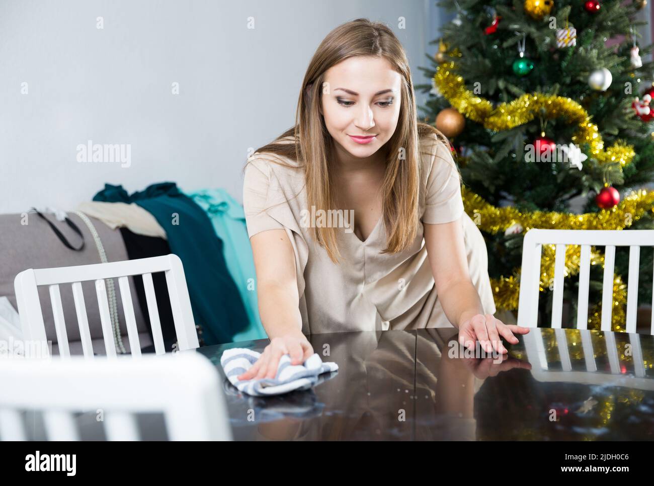 Woman cleaning table before dinner Stock Photo - Alamy