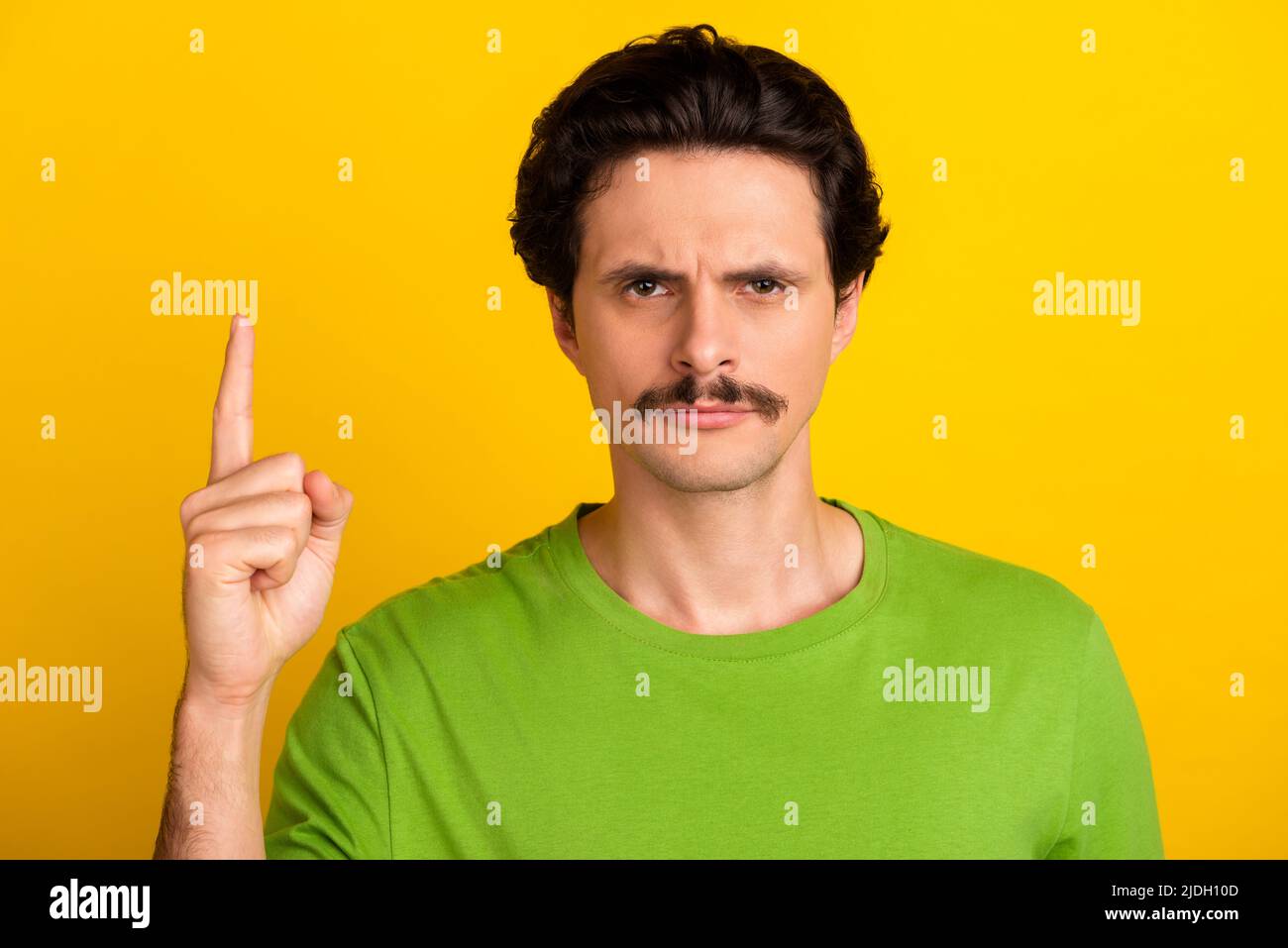 Photo of focused concentrated man strict face point finger look camera ...