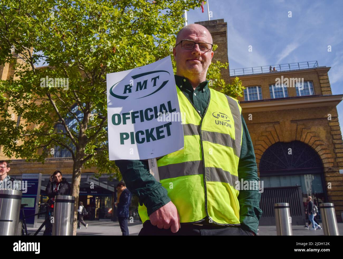 London, UK. 21st June 2022. An RMT union member holds an 'Official ...