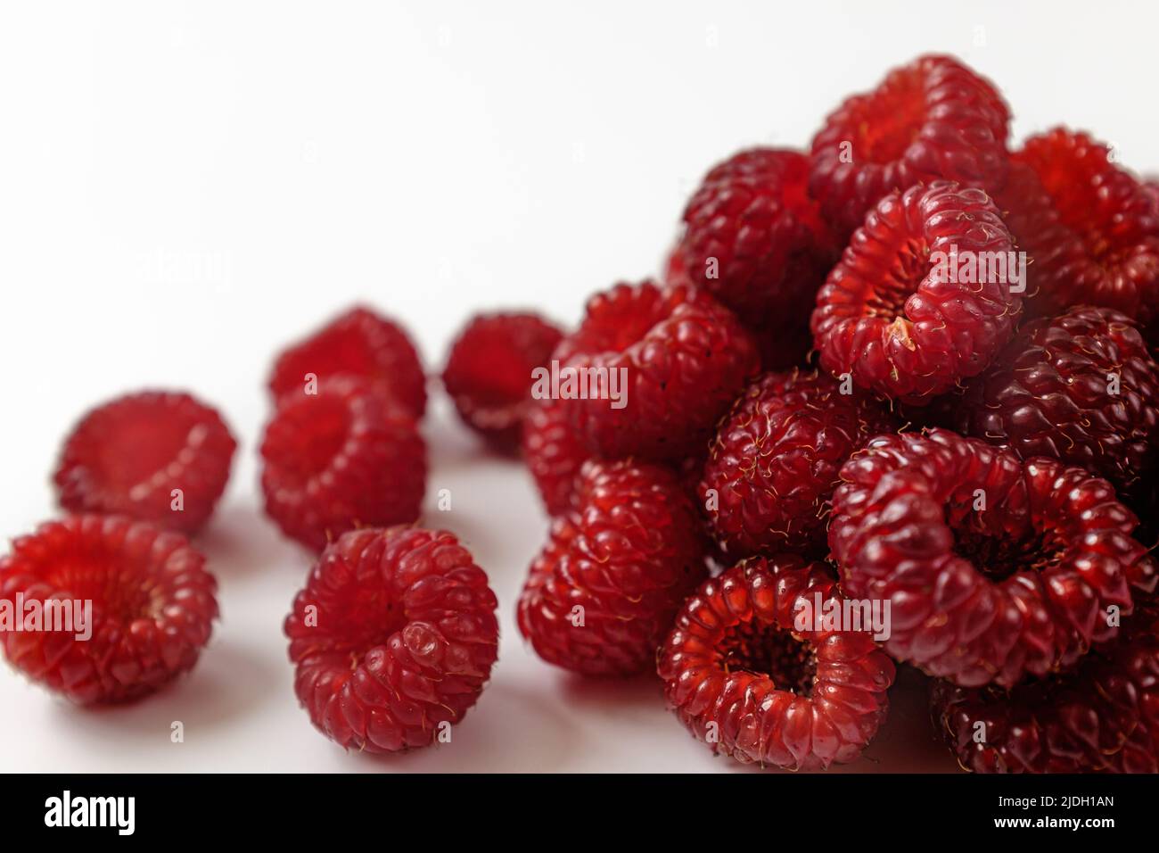 raspberries on a white background Stock Photo - Alamy