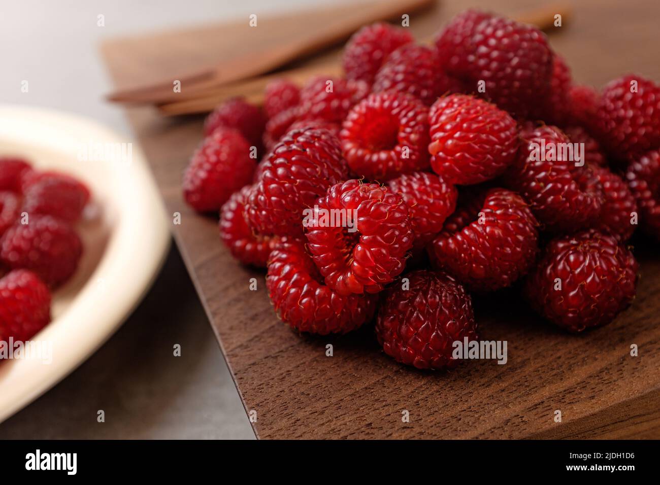 Small, red, sour and sweet fruit raspberries Stock Photo - Alamy