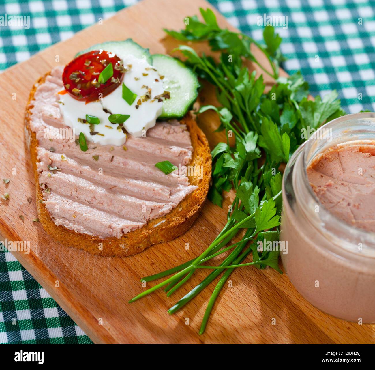 Canape with pate and young cheese at fresh bread, served with greens ...