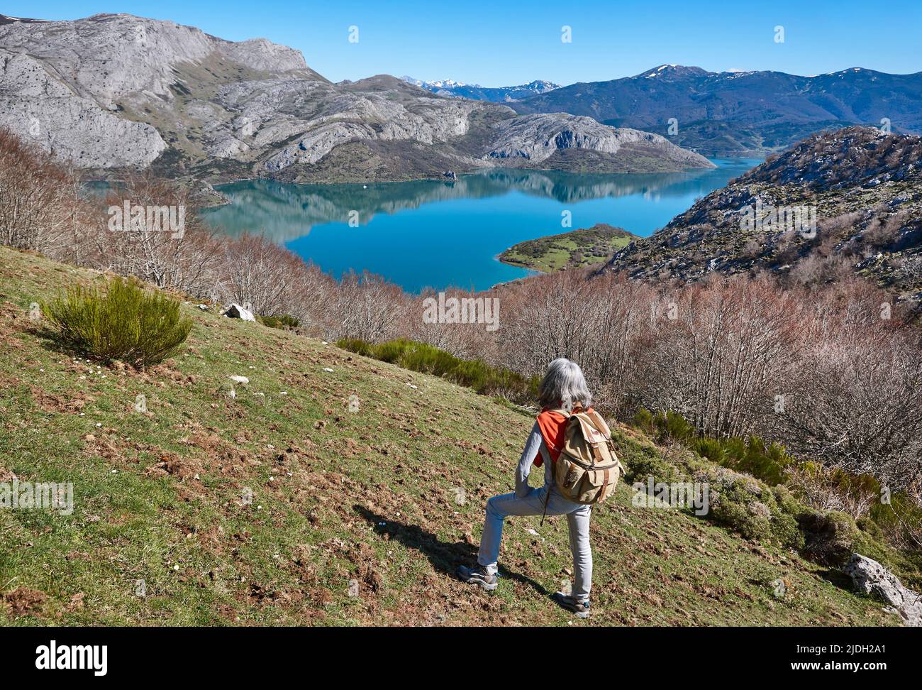 Picturesque reservoir and mountain landscape in Riano. Hikers. Spain ...