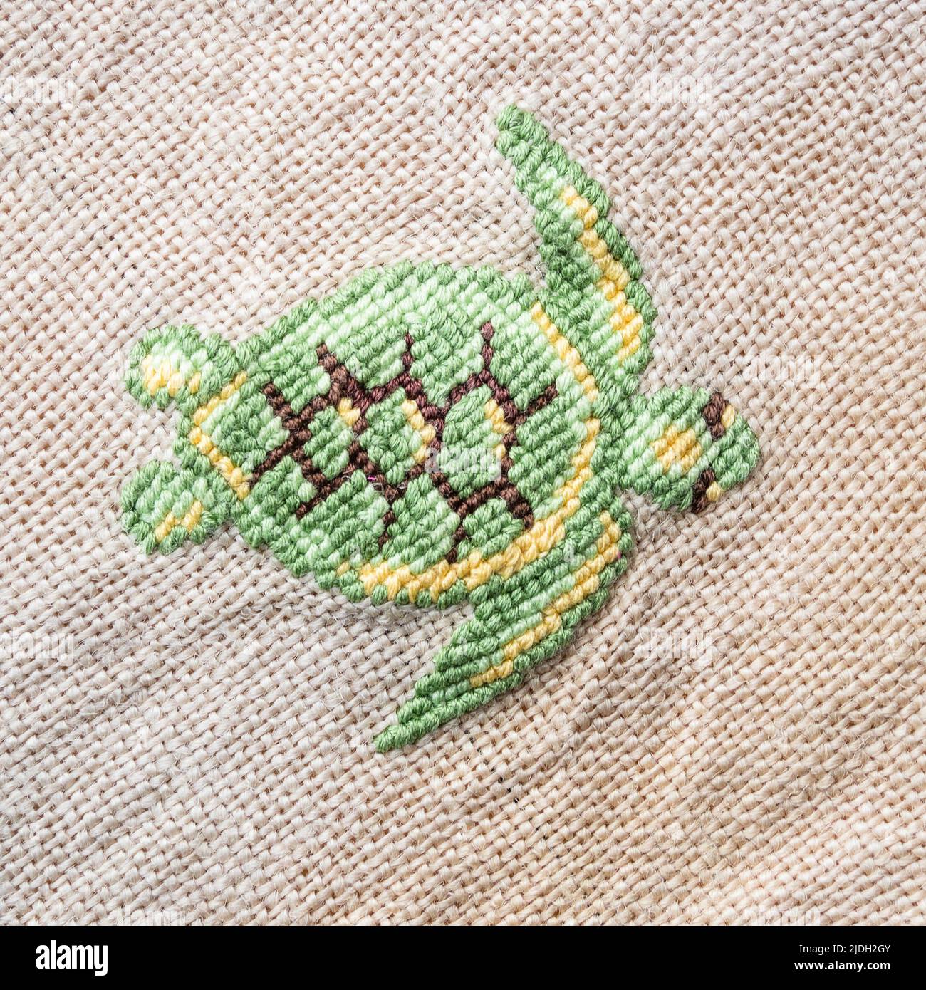 floating sea turtle embroidered by hand on fabric close up Stock Photo ...