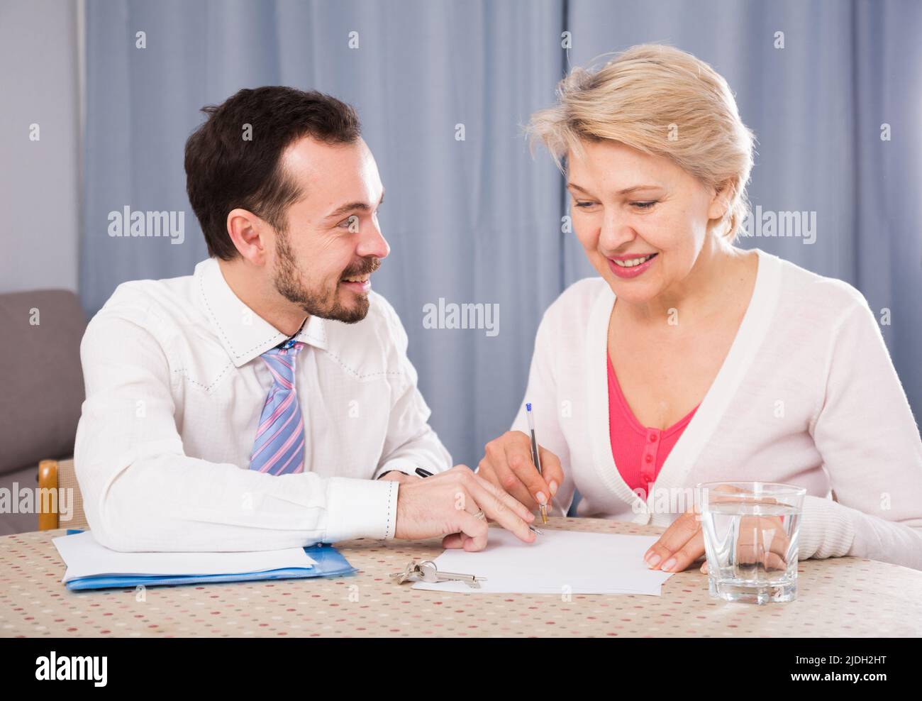 Mature woman and rent agent Stock Photo - Alamy
