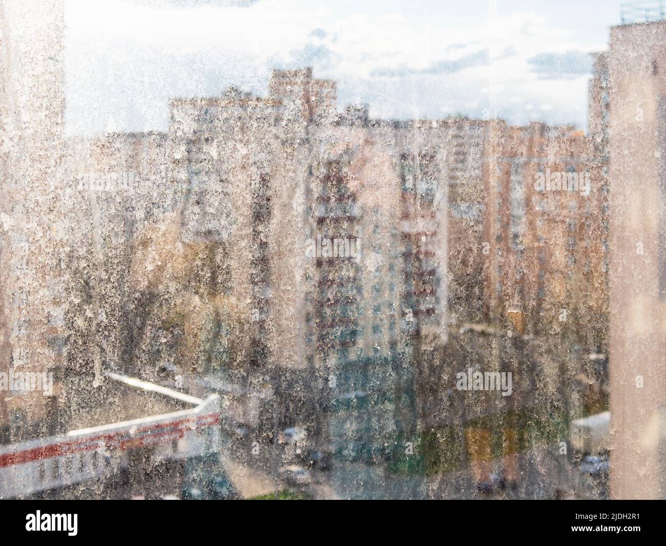 street view through dirty window glass in multi-storey residential ...