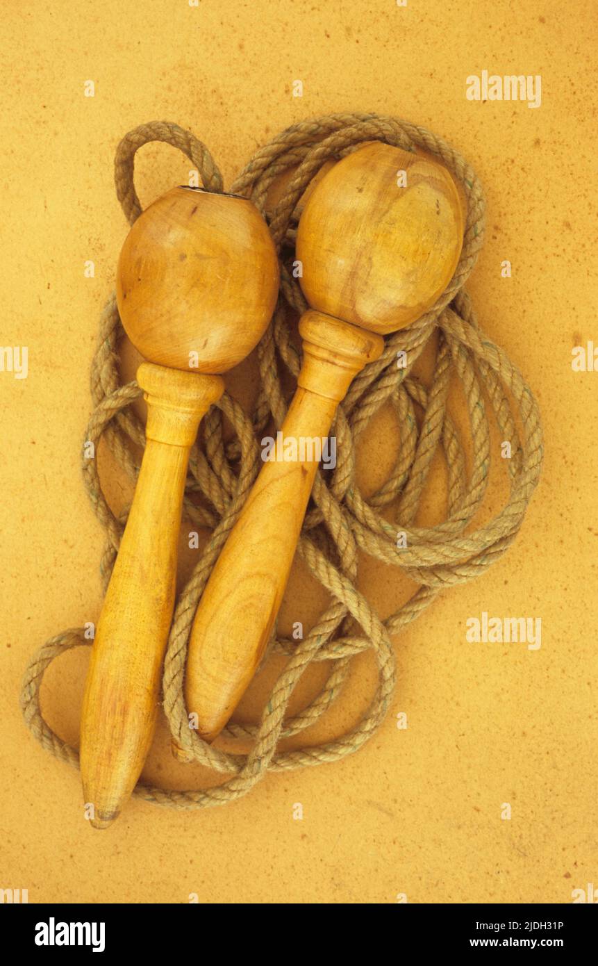 Close up of traditional skipping rope with carved and turned wooden ...