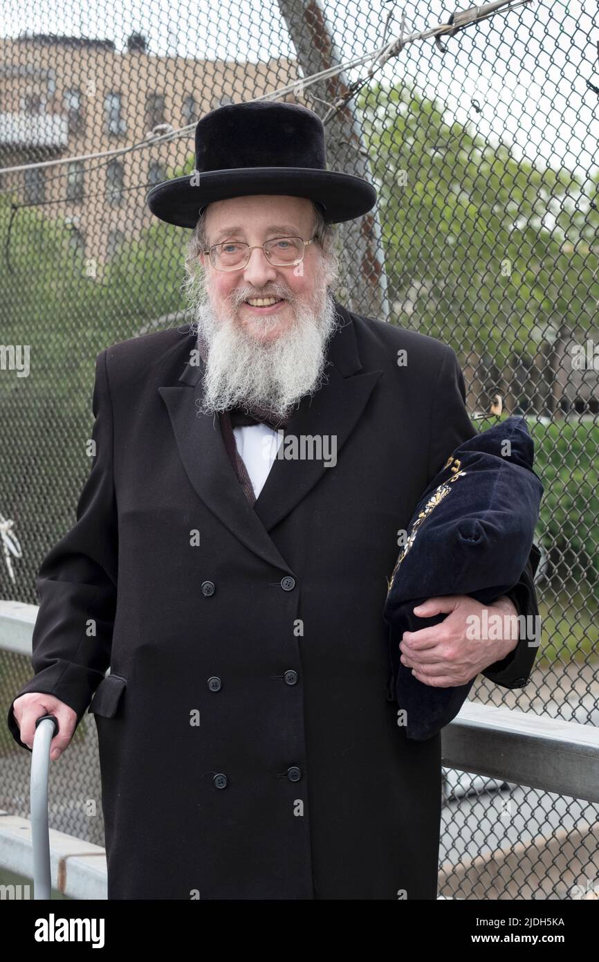 Posed portrait of a Jewish man who teaches religion. On the way to ...