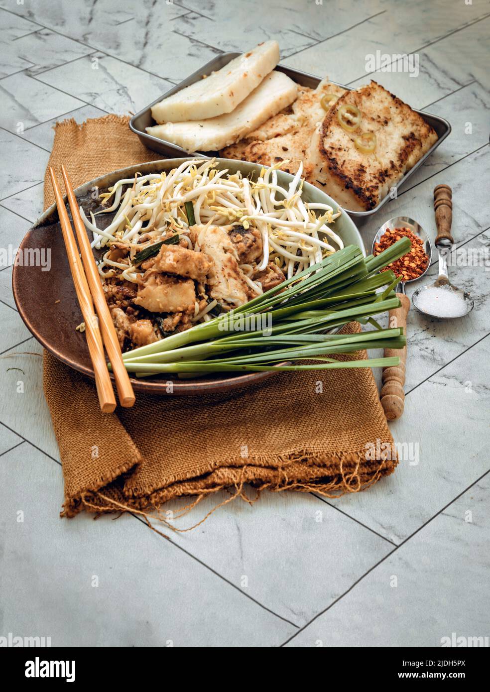 Stir fried soft turnip cake or Fried radish cake (chai tow kway) with ...