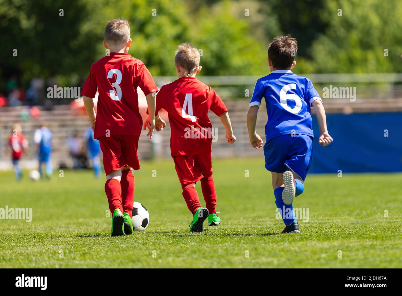 Football soccer children tournament match. Kids practicing football on ...