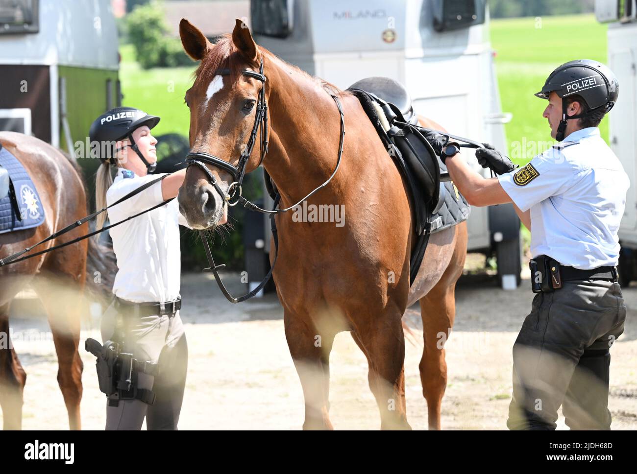 Wallgau, Germany. 21st June, 2022. Police riders supply their horses at ...