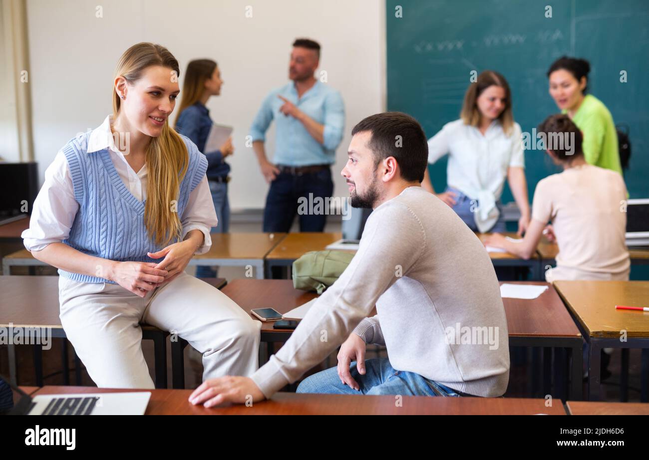 Positive students communicating during recess between lectures in ...