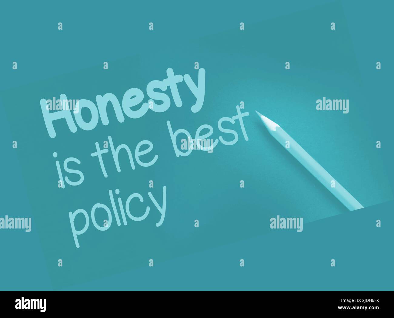 Honesty is the best policy - written on black paper with yellow pencil ...