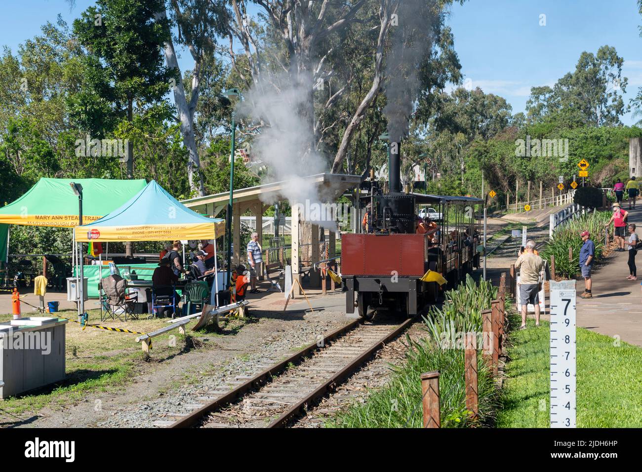 Passengers riding the Mary Ann replica steam locomotive in Maryborough ...