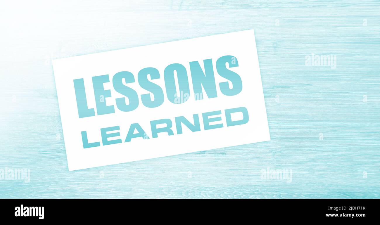blank card with text Lessons learned on wooden background. Business ...