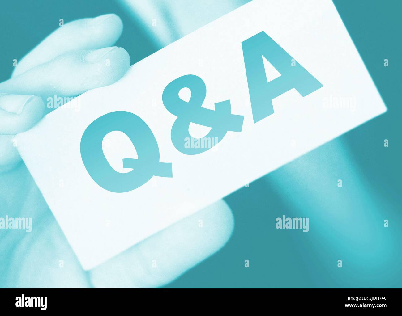 Q and A Questions and Answers sign on business card shown by a ...