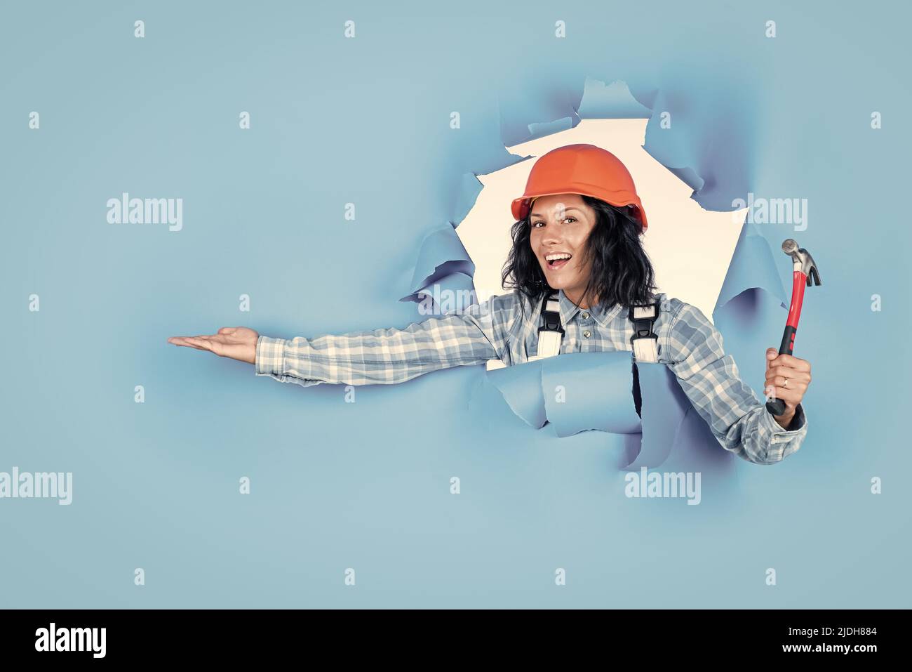 female foreman on construction site. carpenter assistant wear ...