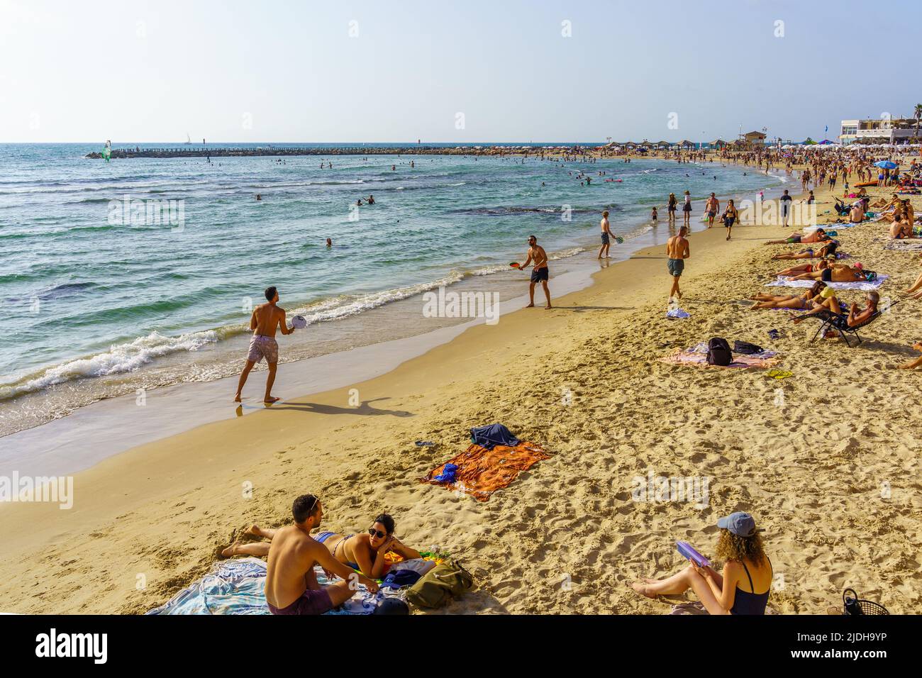 Tel-Aviv, Israel - June 17, 2022: Beach scene with visitors in various ...