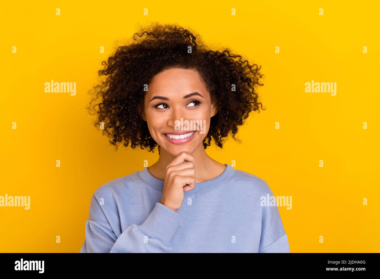 Photo of sweet pretty wavy lady wear blue sweatshirt arm chin looking ...