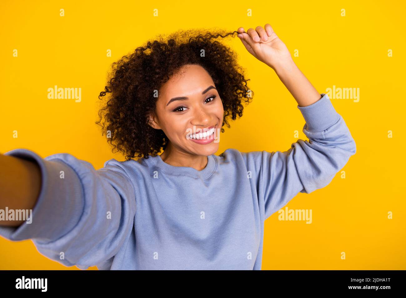 Photo of charming positive person take selfie hand fingers hold play ...