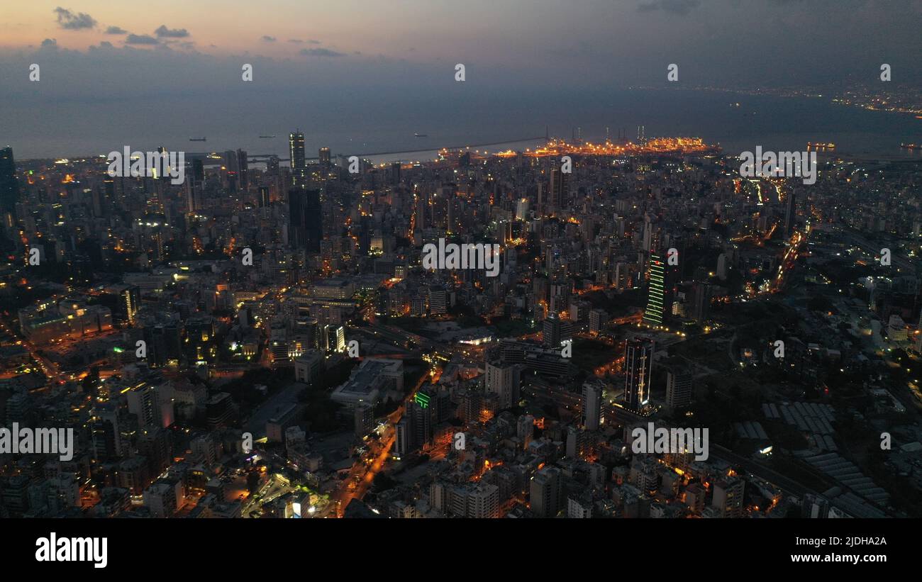 Top aerial night view of Beirut downtown, coastline and bright marina ...