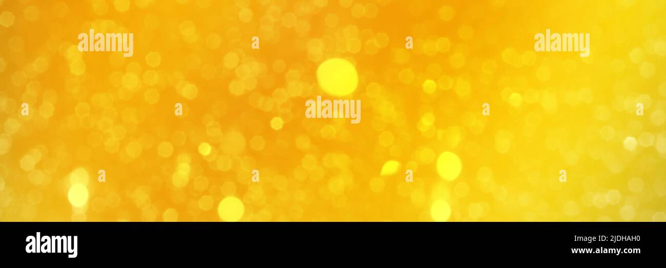 Bright yellow sparkling glitter bokeh background, banner texture ...