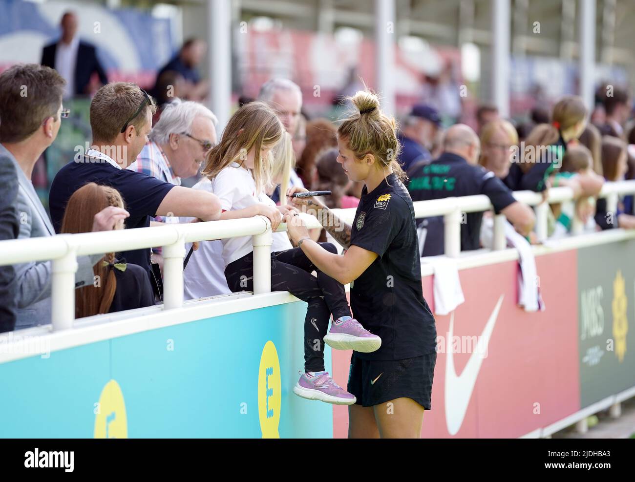 England's Rachel Daly signs an autograph for fans during a training ...