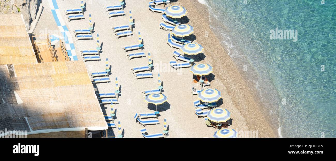 View from above, stunning aerial view of some beach umbrellas on a ...